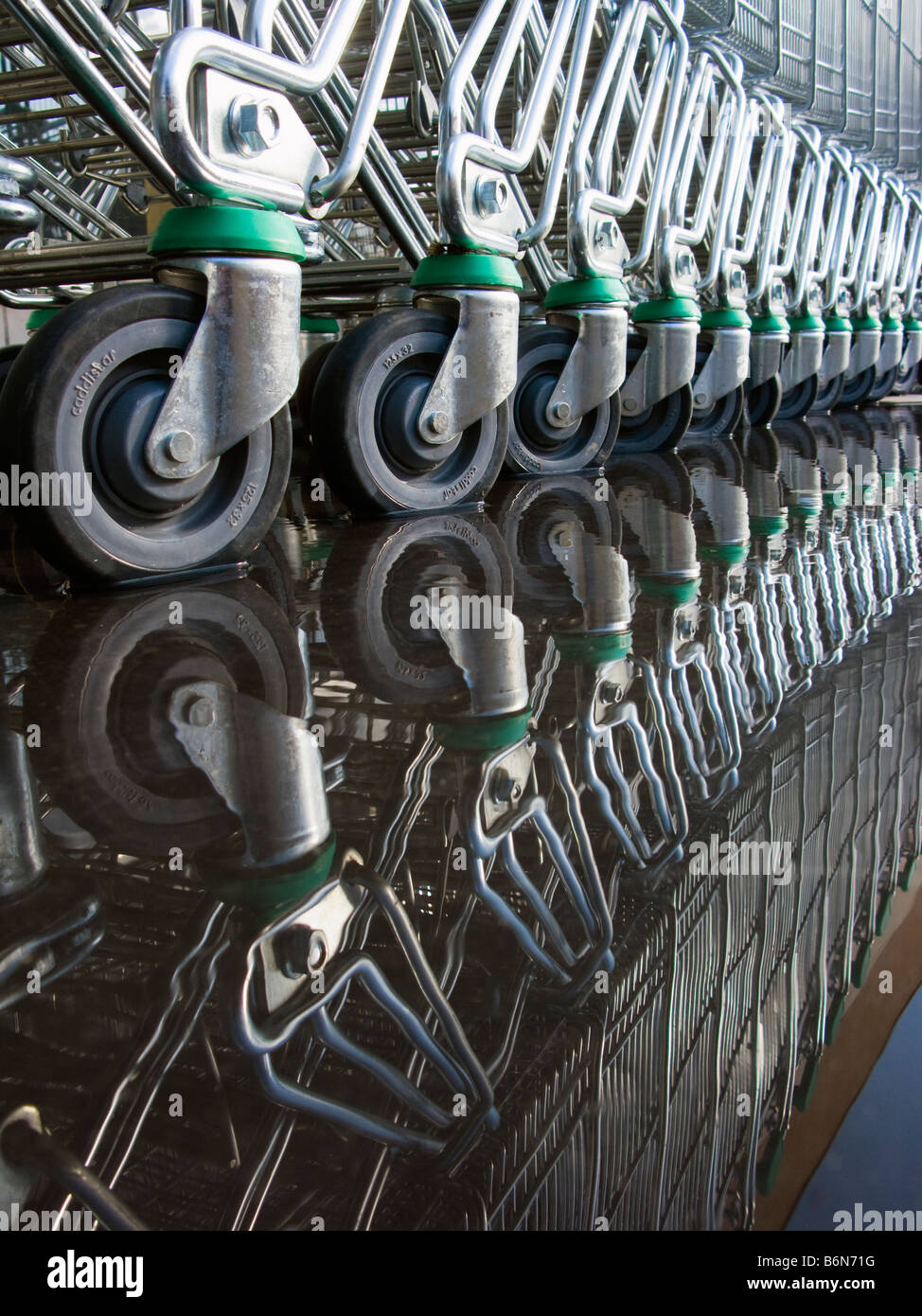 Shopping trolleys parked in puddle Stock Photo - Alamy