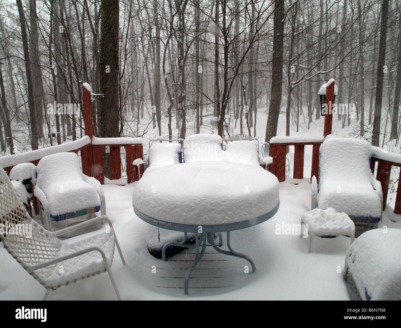 Accumulated snow on patio furniture in upstate NY winter Stock Photo ...
