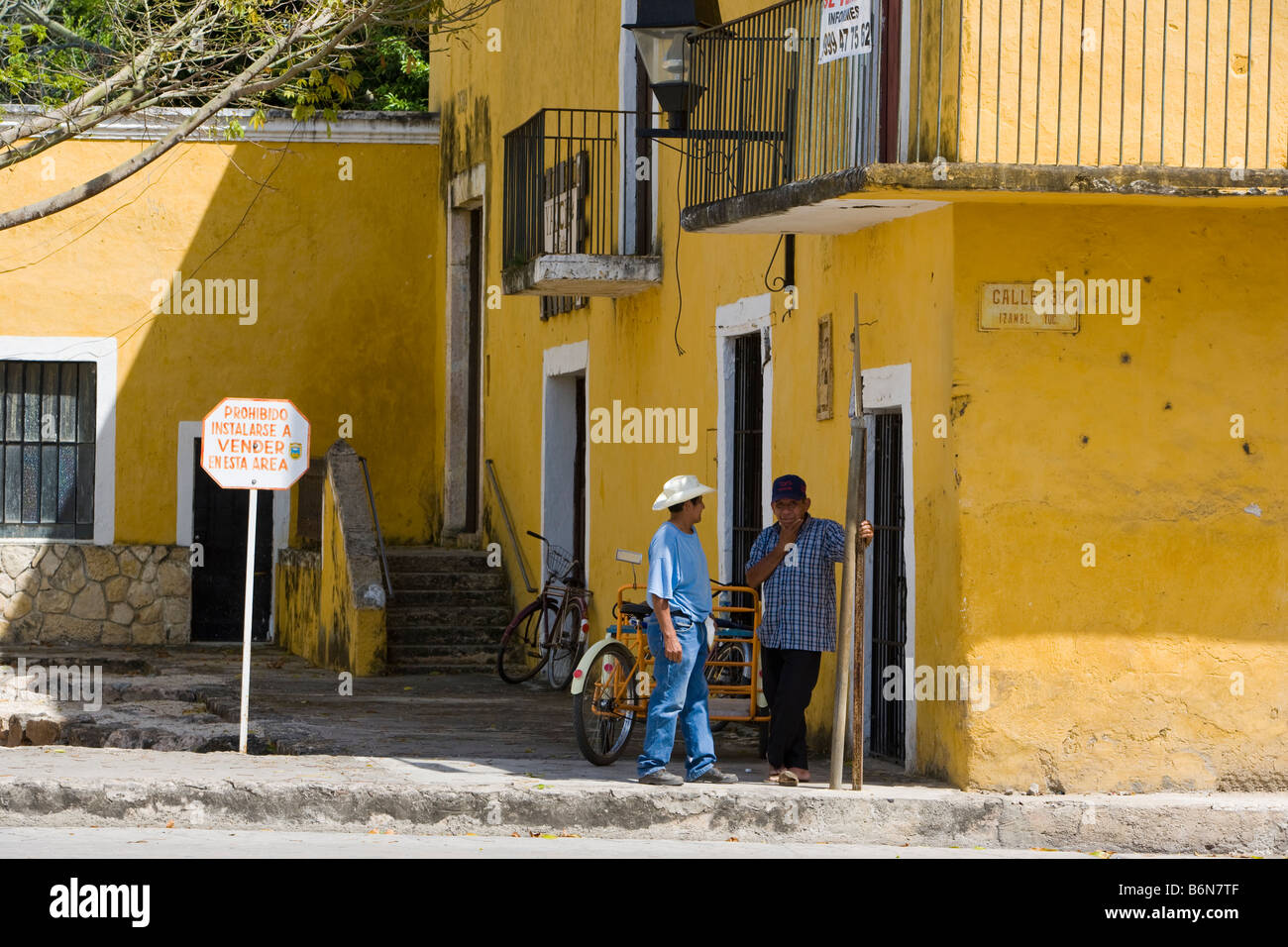 Men standing on a street corner Izamal Yucatan Mexico Stock Photo - Alamy