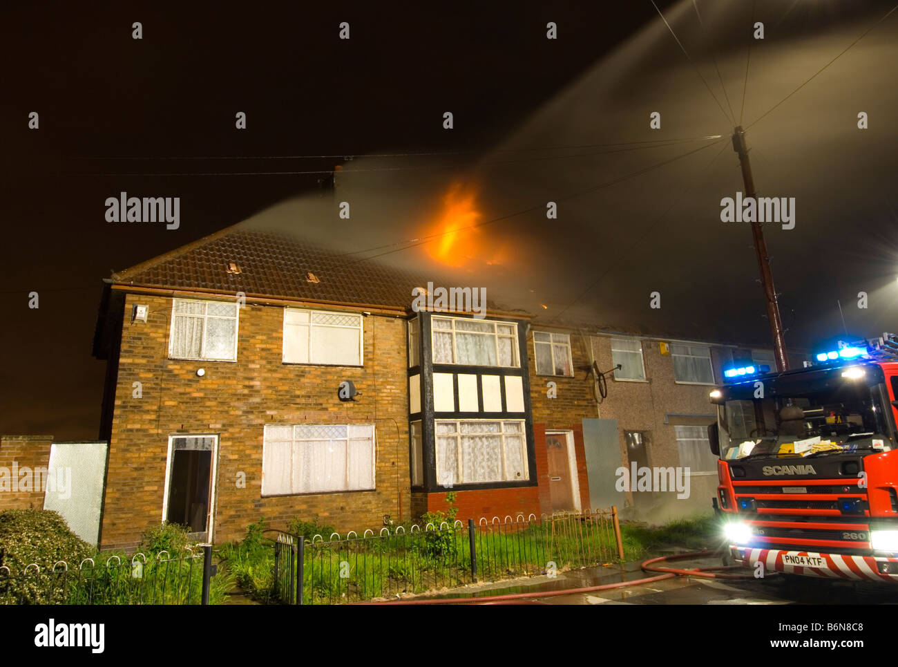 Firefighters from a Fire & Rescue Service UK tackle a bedroom house ...