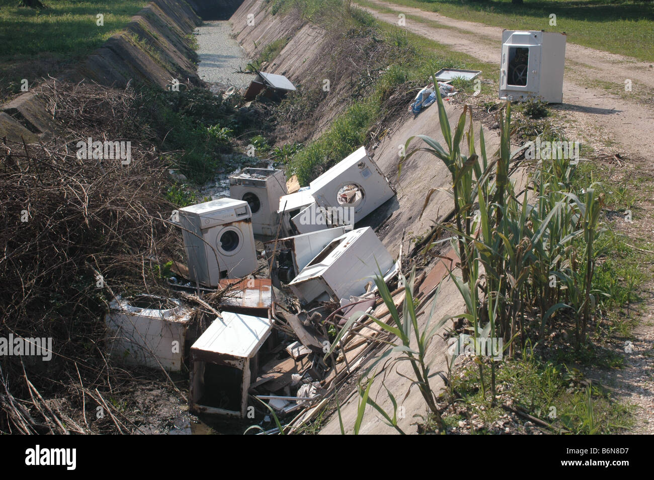 Old washing machines abandoned Stock Photo - Alamy