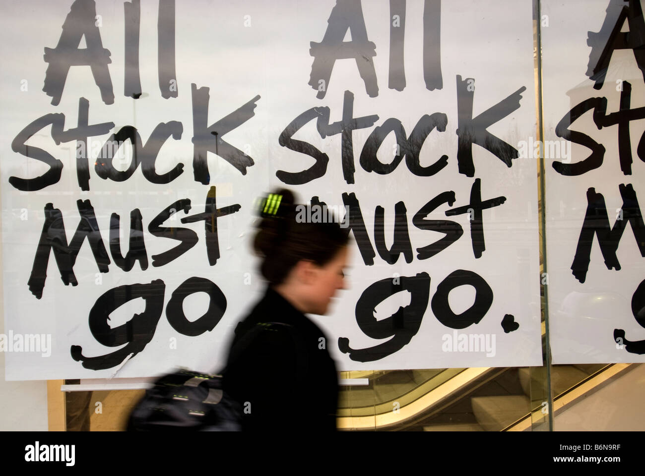 all stock must go on a shop window closing down Stock Photo - Alamy