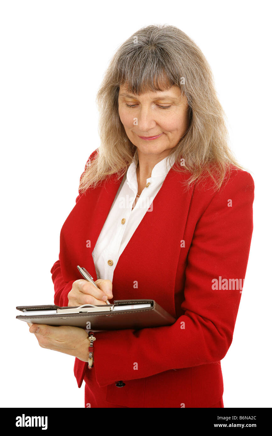 Mature businesswoman or realtor taking notes on a clipboard Isolated on ...