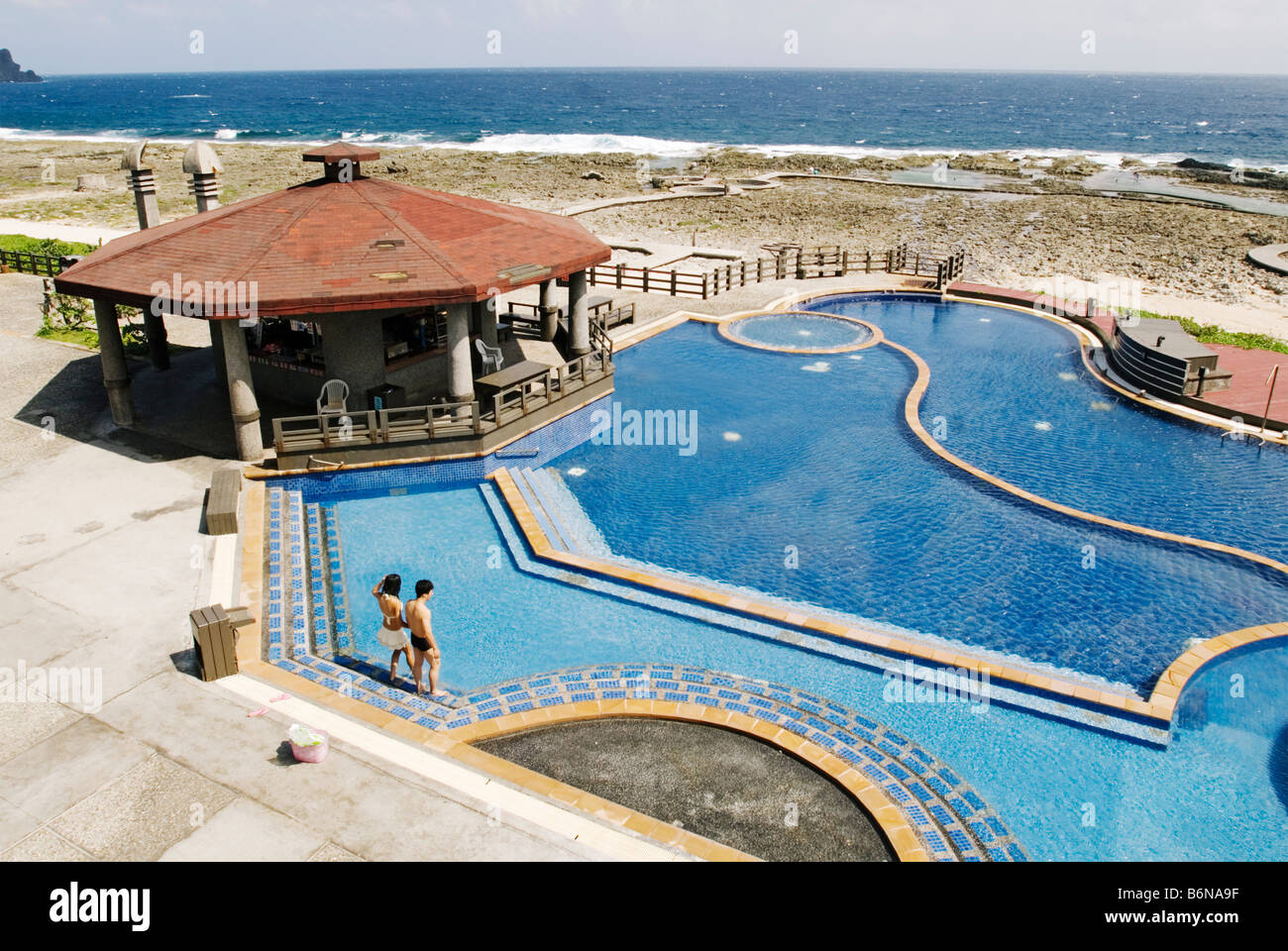 Taiwan, Couple Wading In The Pool At Green Island Jhaorih Saltwater Hot ...