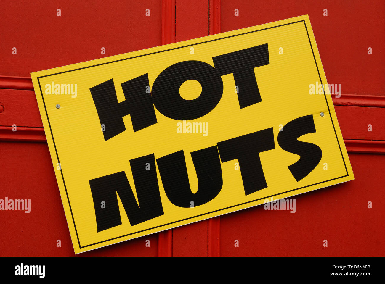 A sign advertising 'Hot Nuts' Stock Photo - Alamy