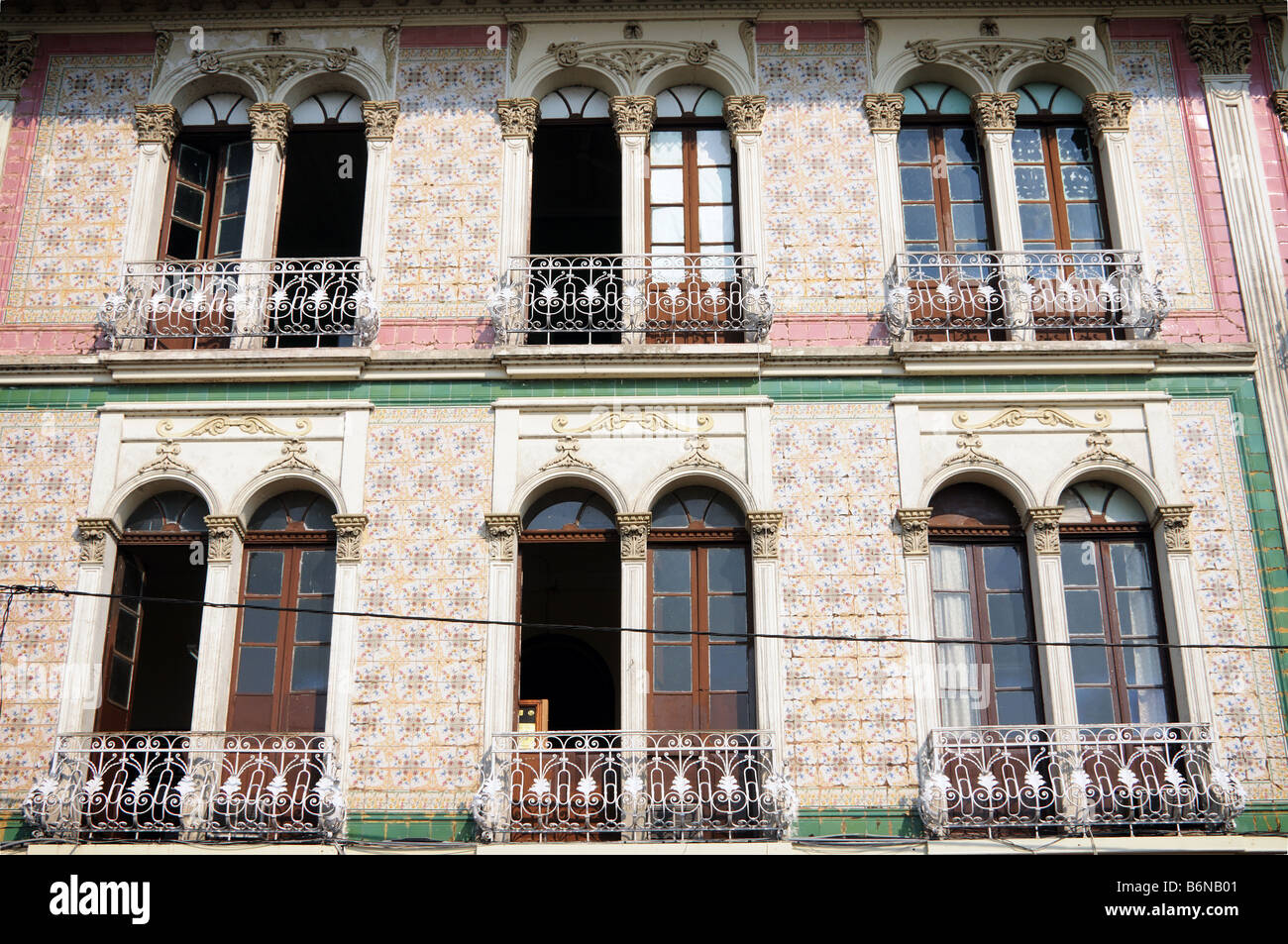 The tiled facade of the Palace Hotel, built during the rubber boom, in ...