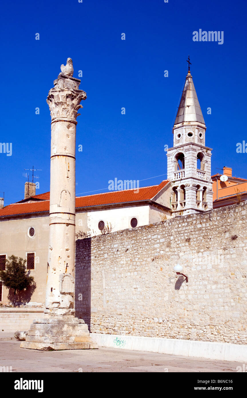 The bell tower of the St IIia church and a Roman column in Zadar ...