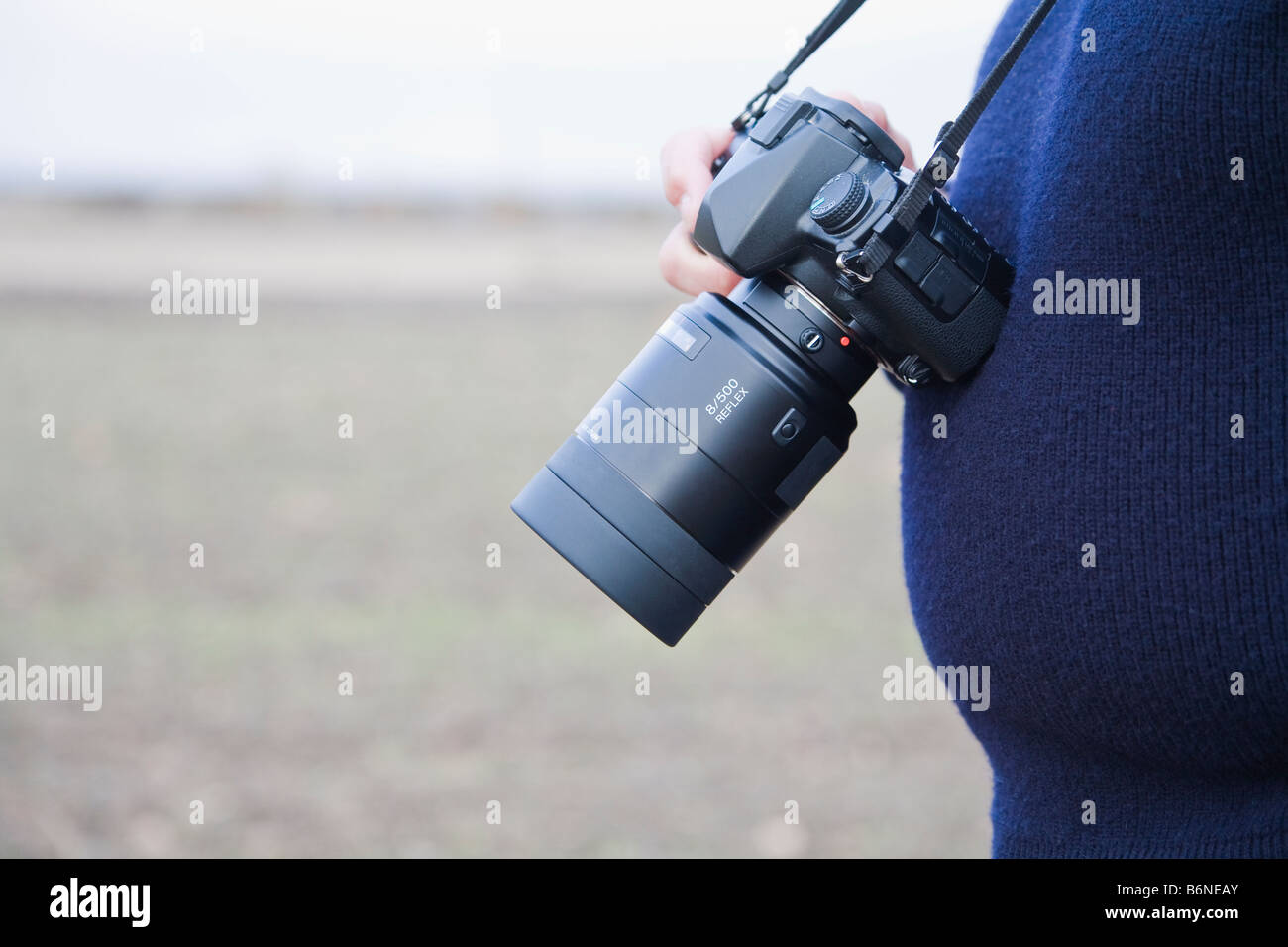 Fat man with camera resting on stomach Stock Photo - Alamy