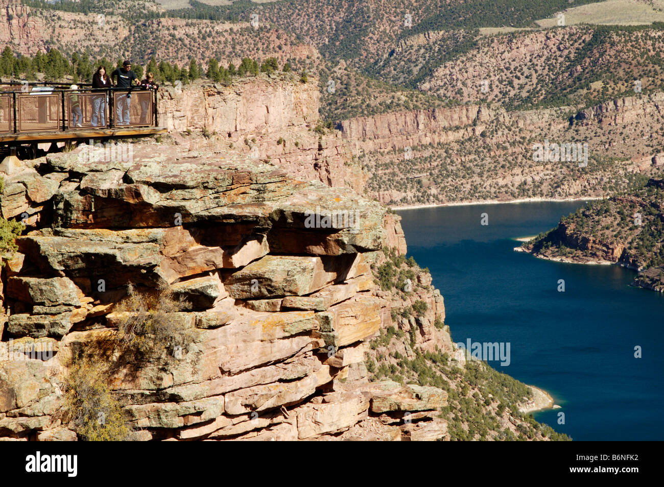 a family viewing the Flaming Gorge reservoir from an overlook platform ...