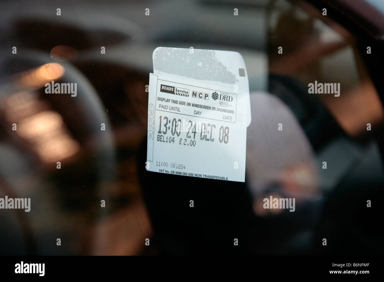 pay and display parking ticket displayed on a car window on christmas ...