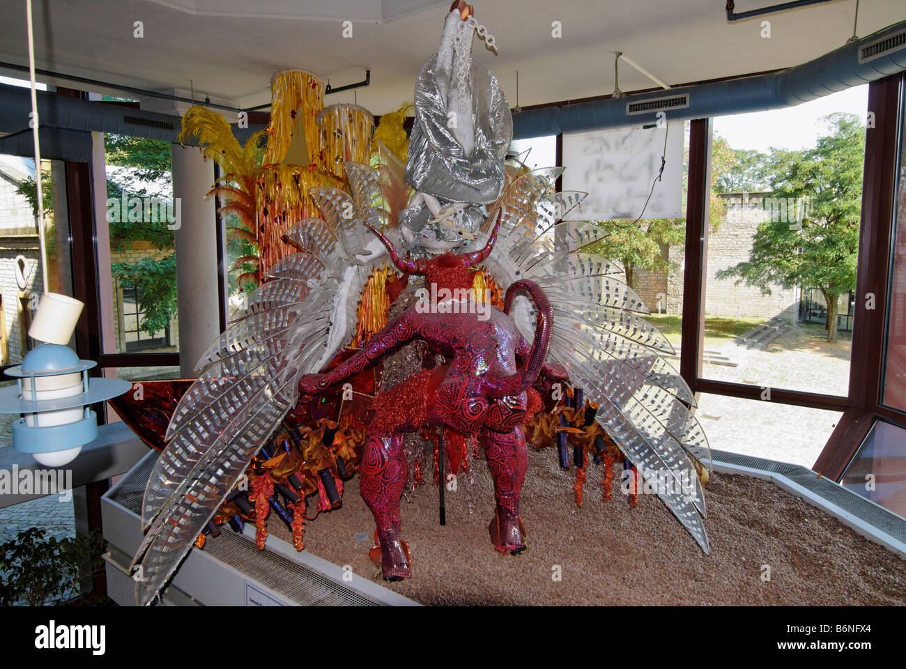 Carnival figures of the white swan and red devil designed by Paul ...