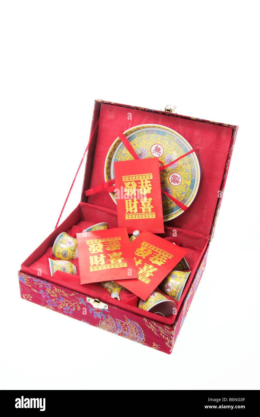 Chinese Tea Set and Red Packets Stock Photo - Alamy