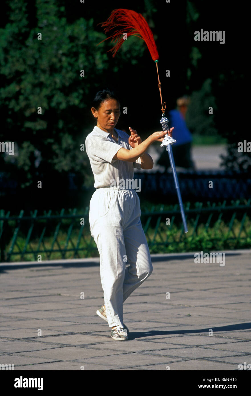 Chinese woman performing taichi, morning exercise, Temple of Heaven ...