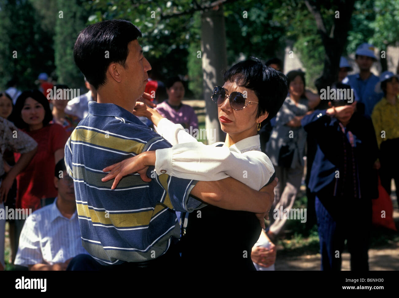 Chinese man and Chinese woman dancing, dance lessons, morning exercise ...