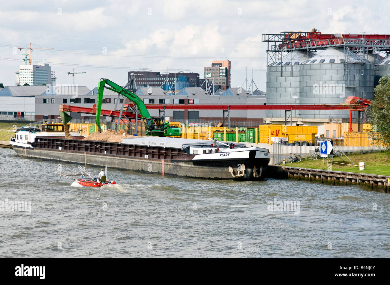 Amsterdam-Rhine Canal shipping dock with barge being loaded Stock Photo ...