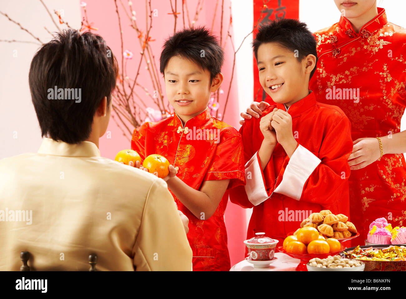 children greeting to man with woman standing behind them Stock Photo ...