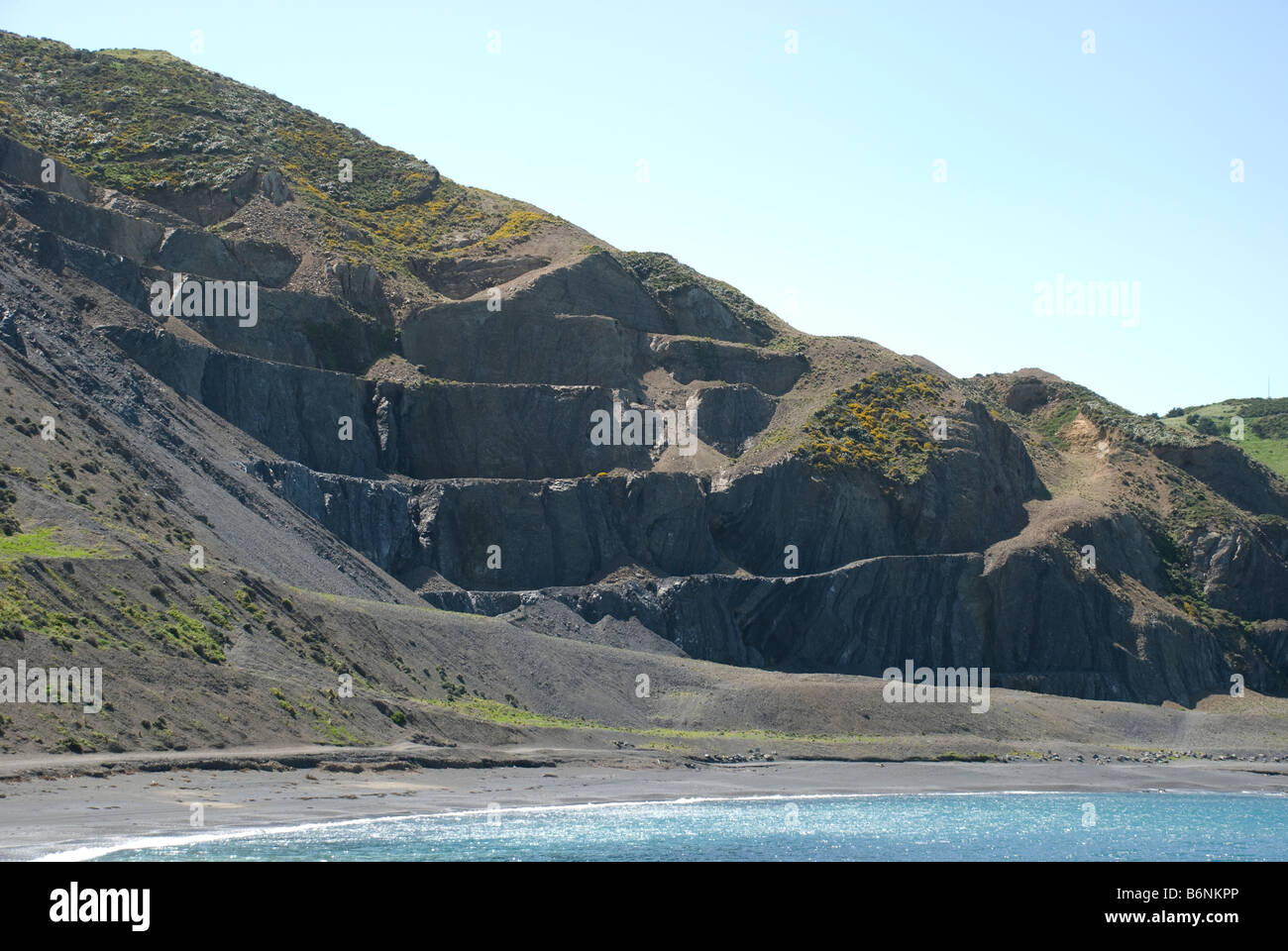 Red rock beach in Wellington Stock Photo - Alamy