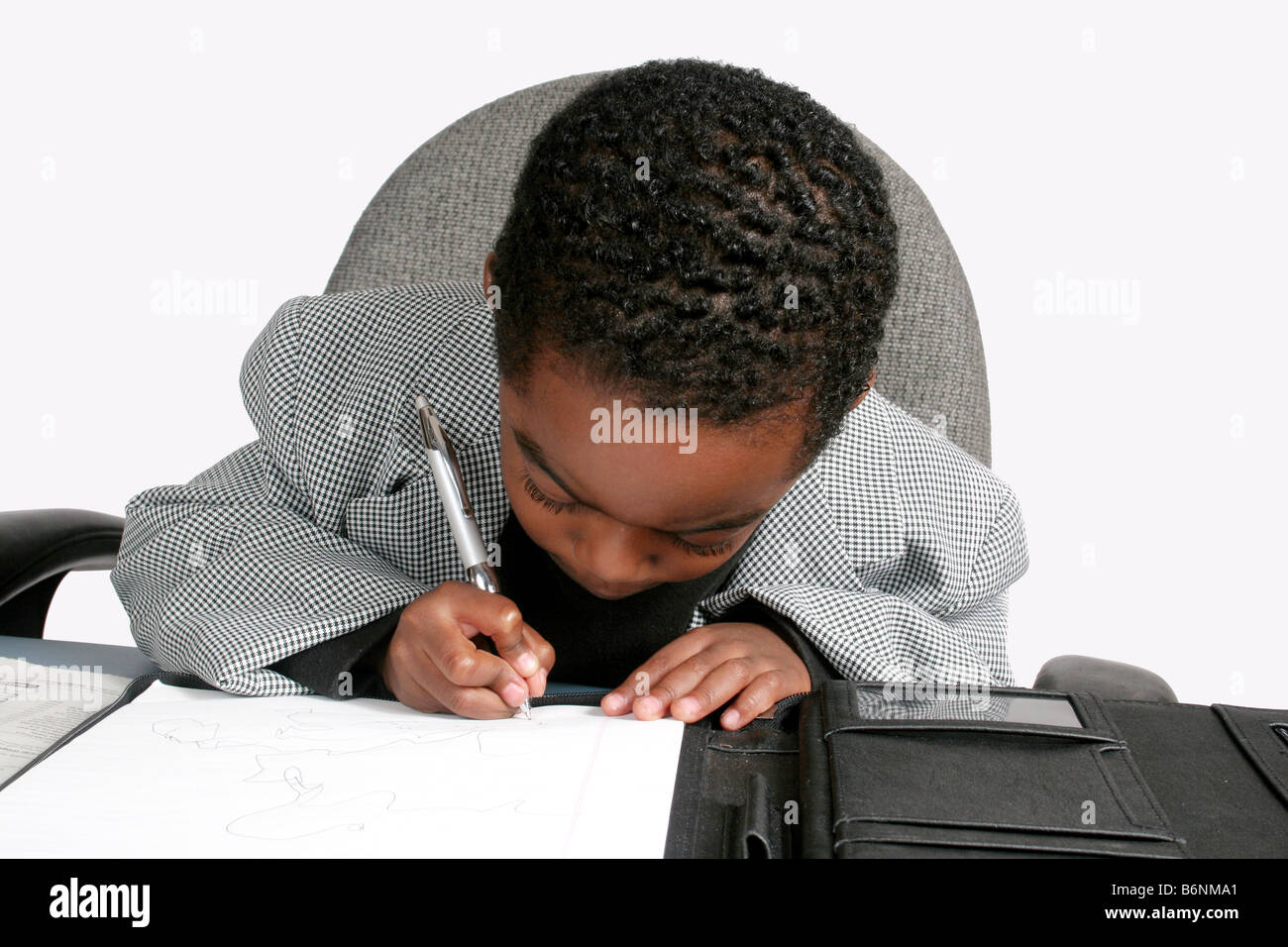 Young businessman, serious writing Stock Photo - Alamy