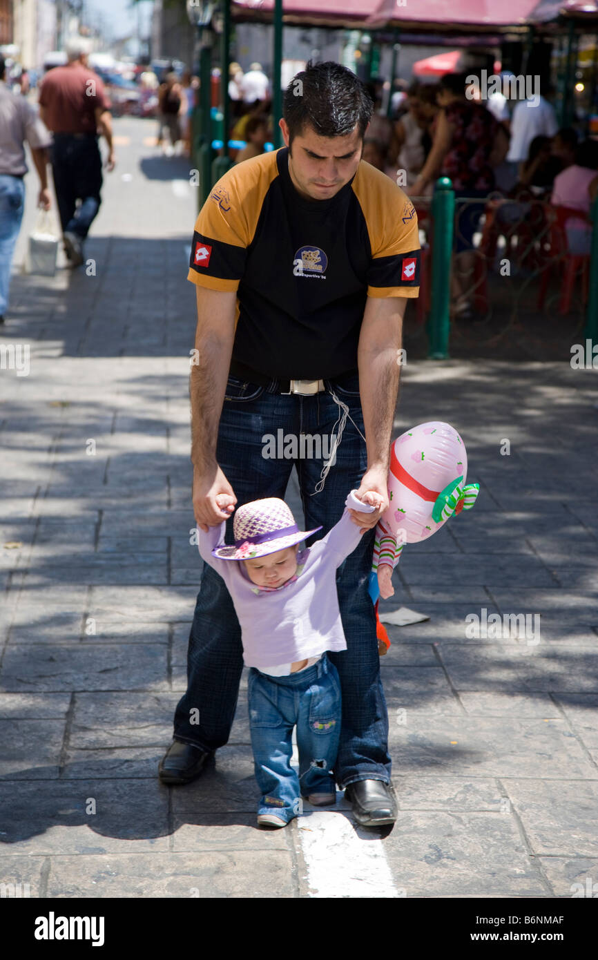 Man with child Merida Yucatan Mexico Stock Photo - Alamy
