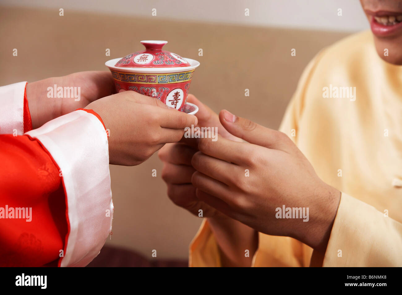 man accepting tea from his son Stock Photo - Alamy