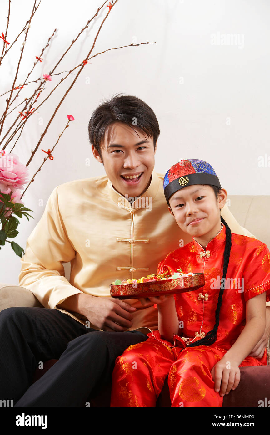 man and boy holding candy tray Stock Photo - Alamy