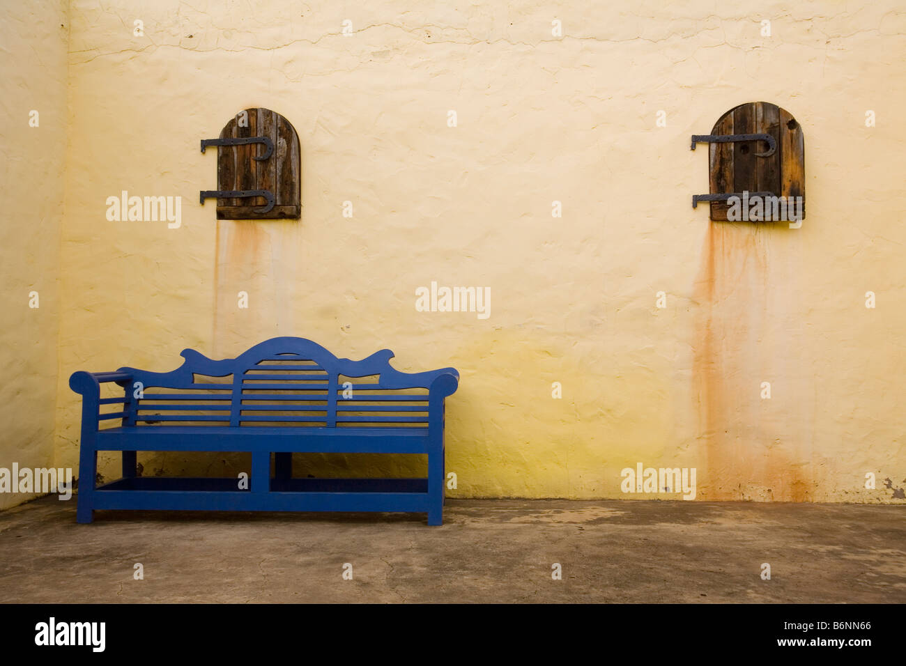 Ghana, west coast, Fete village. Wall and bench, White Sands Resort ...