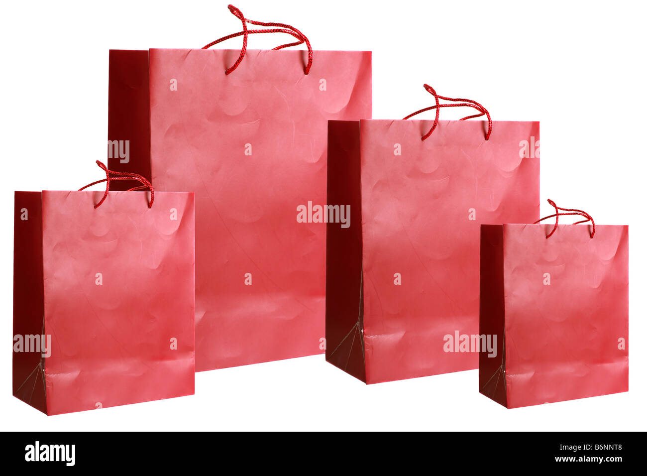 Four red paper bags for special offer prizes over white background ...