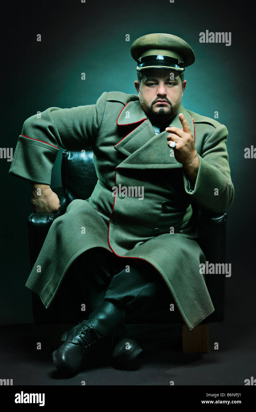 The evil dictator sitting Stock Photo - Alamy