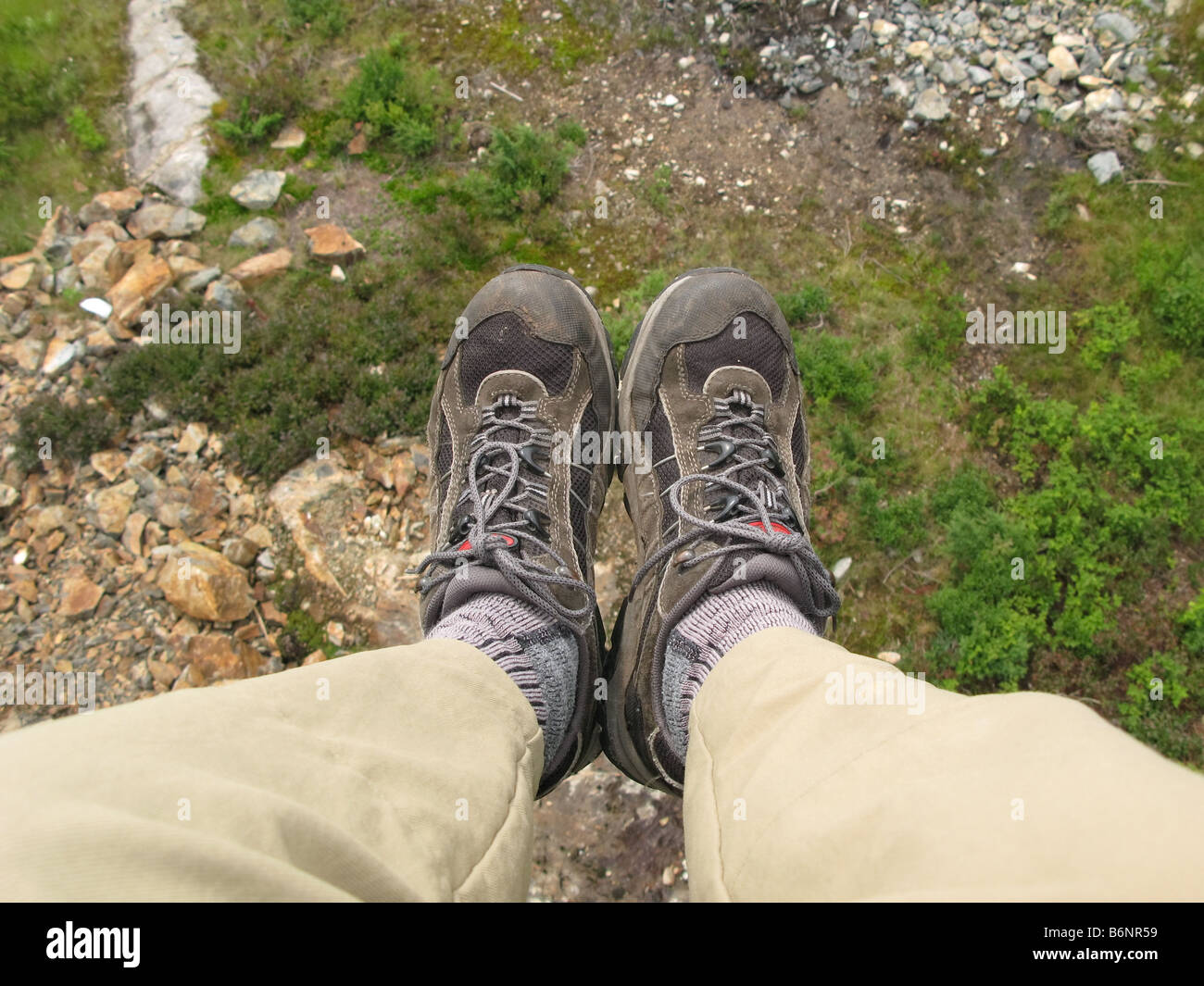 Feet hanging in midair from chairlift Stock Photo - Alamy