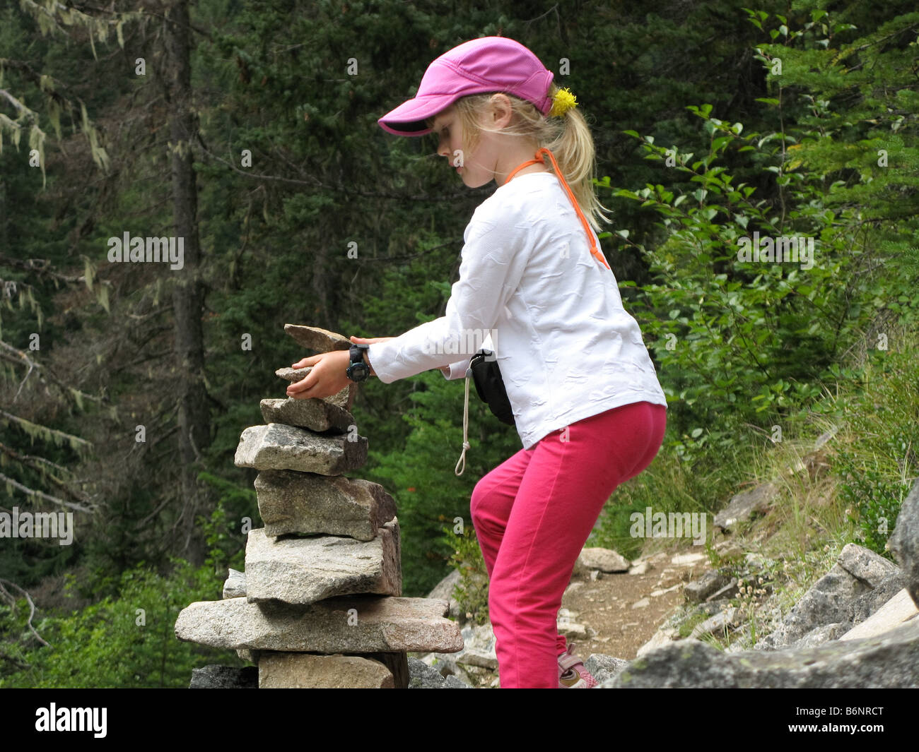 Child stacking rocks hi-res stock photography and images - Alamy