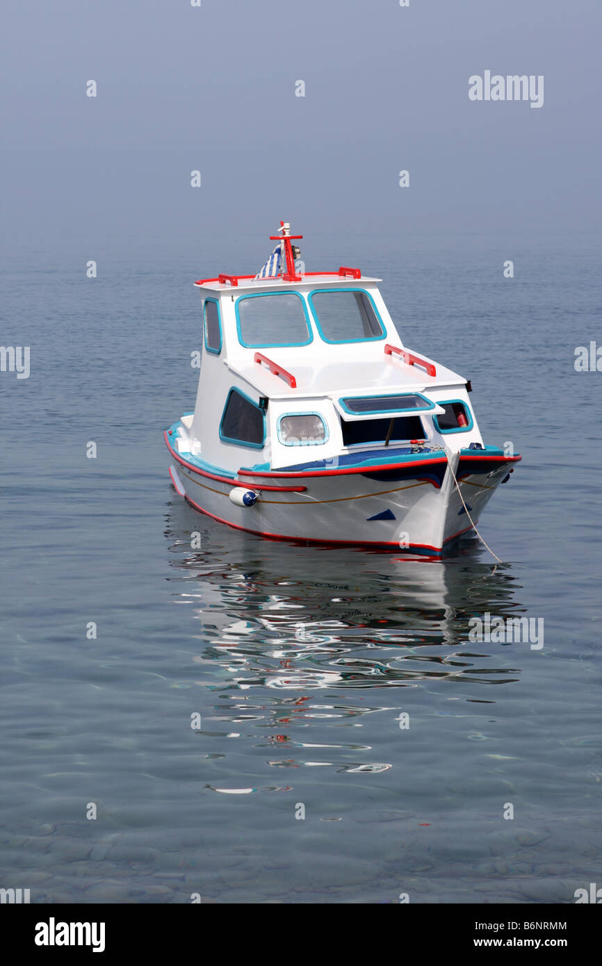 colorful traditional greek small wooden fishing boat Stock Photo - Alamy