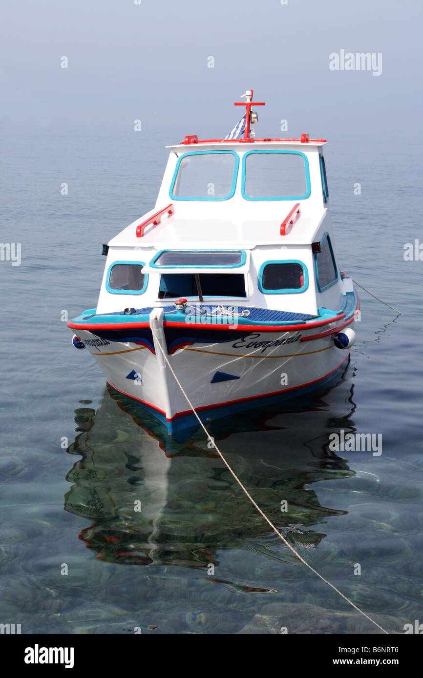 colorful traditional greek small wooden fishing boat moored Stock Photo ...