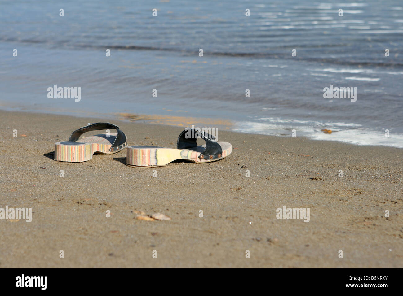 closeup couple of woman sea slippers on the beach with copy space Stock ...