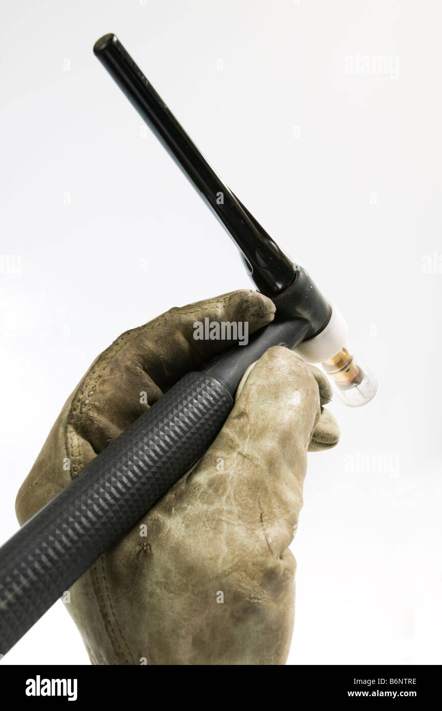 Tig torch in hand Stock Photo - Alamy