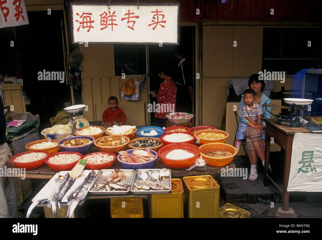 seafood vendor, selling seafood, fresh fish, fish, open-air market ...
