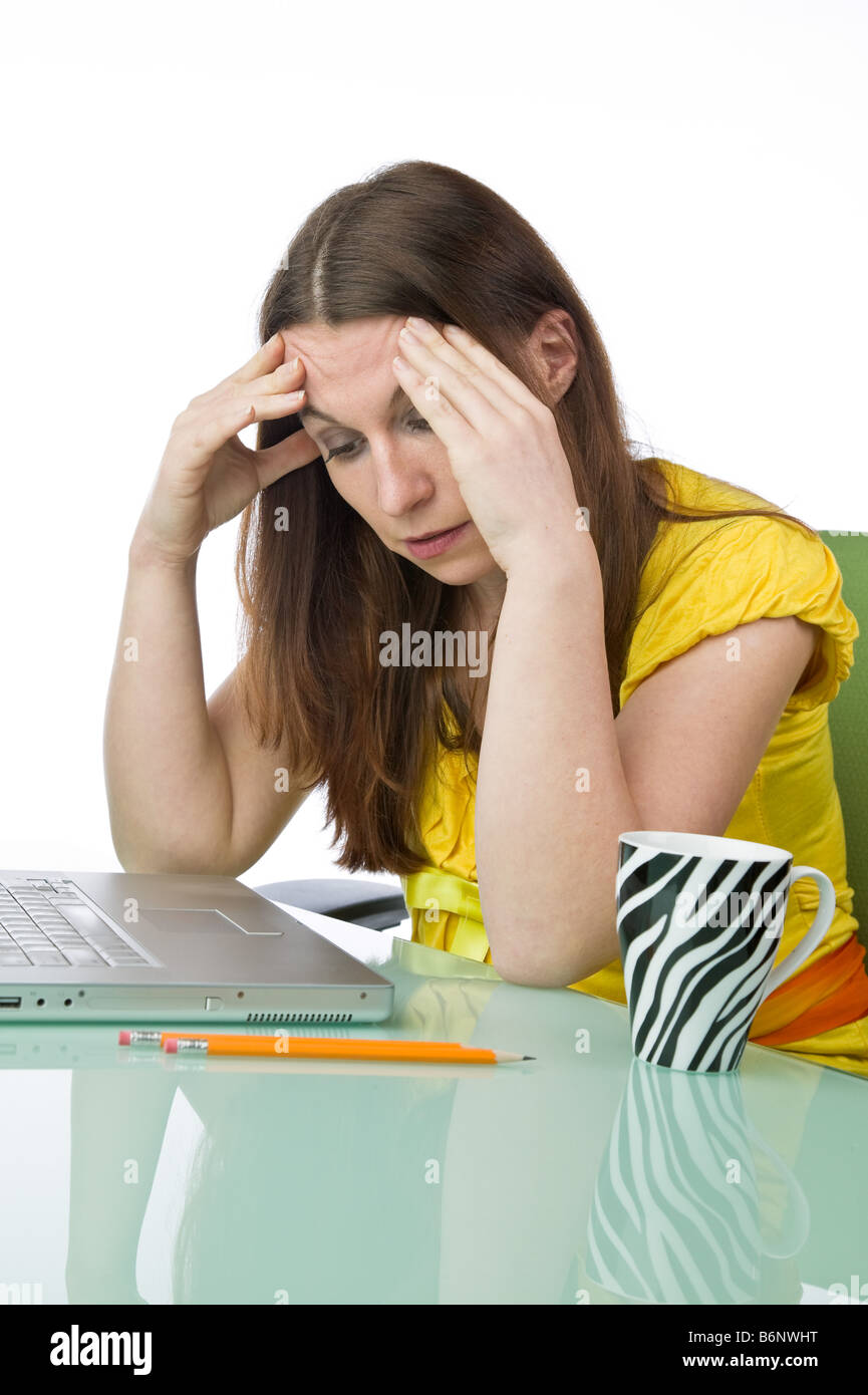 Pretty woman working at her desk against a white background Stock Photo ...