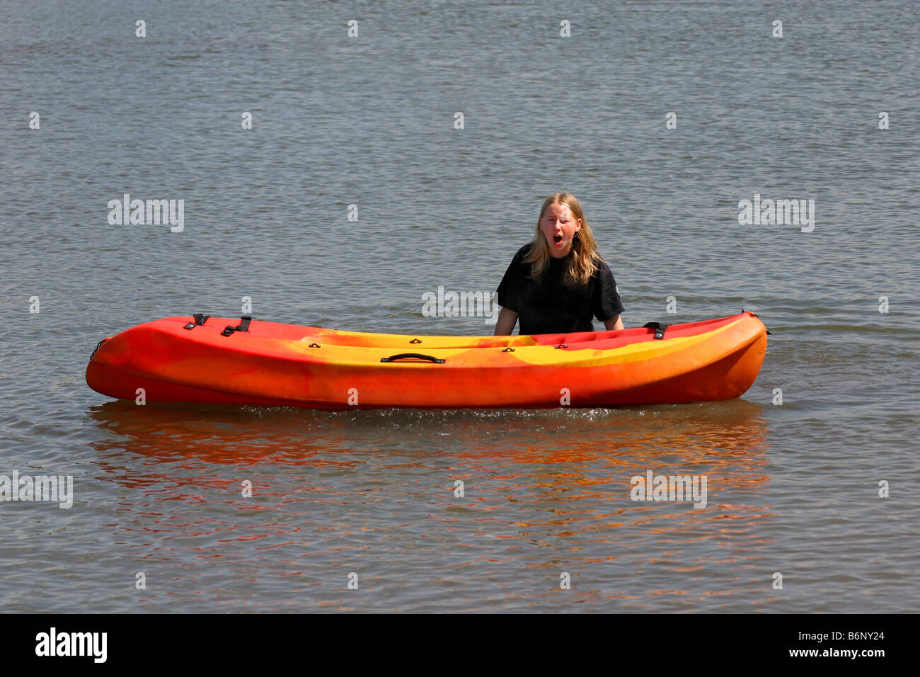 Young blonde teenage girl enjoying her kayak Stock Photo - Alamy