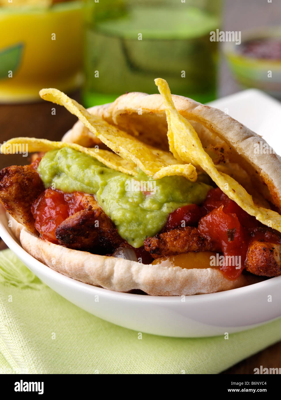 Deep fried spicy chicken in pitta bread wrapped editorial food Stock ...