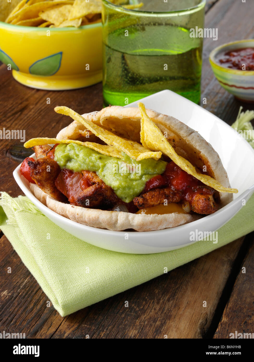 Deep fried spicy chicken in pitta bread wrapped editorial food Stock ...