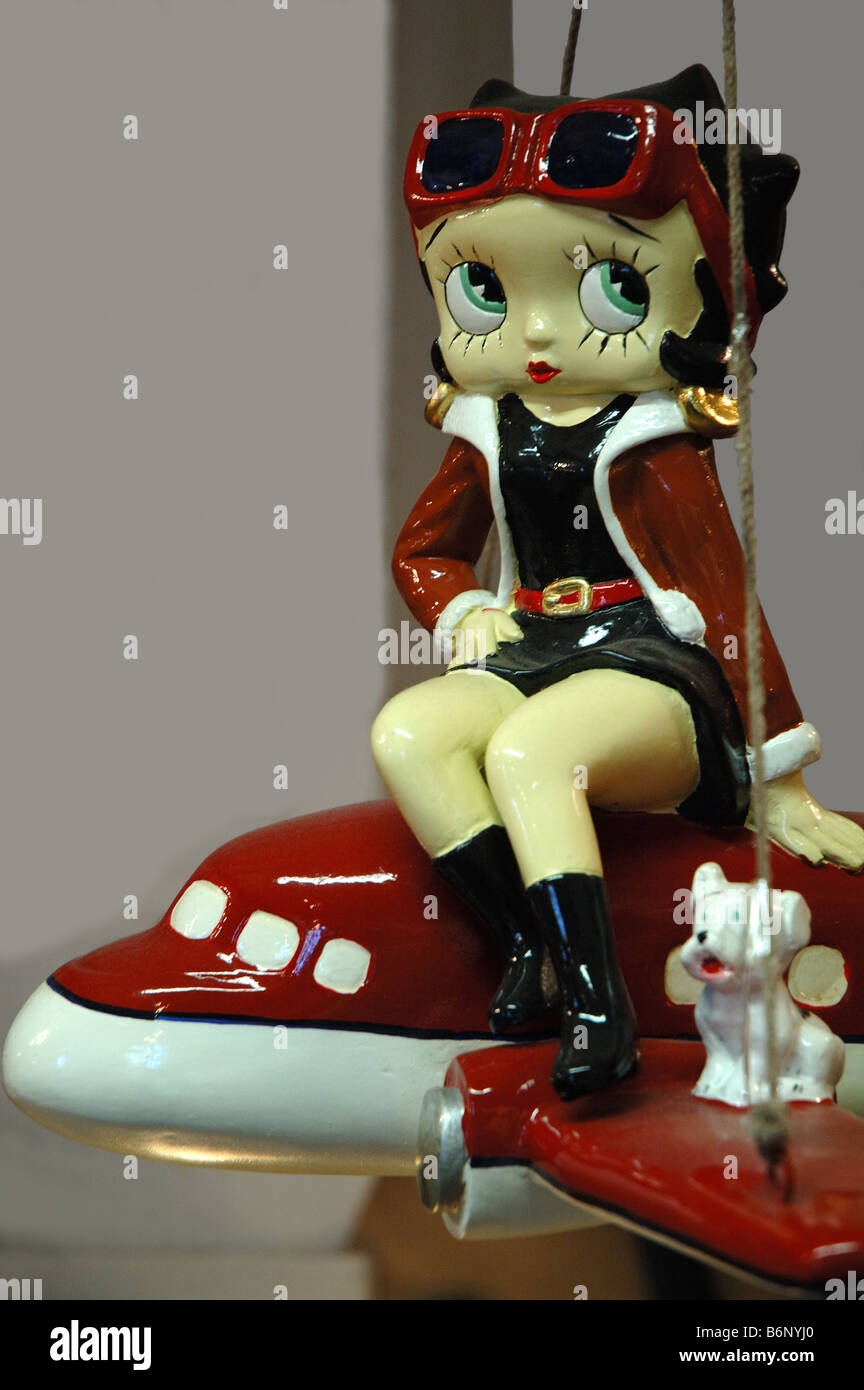 Betty Boop riding side-saddle on an aeroplane Stock Photo - Alamy
