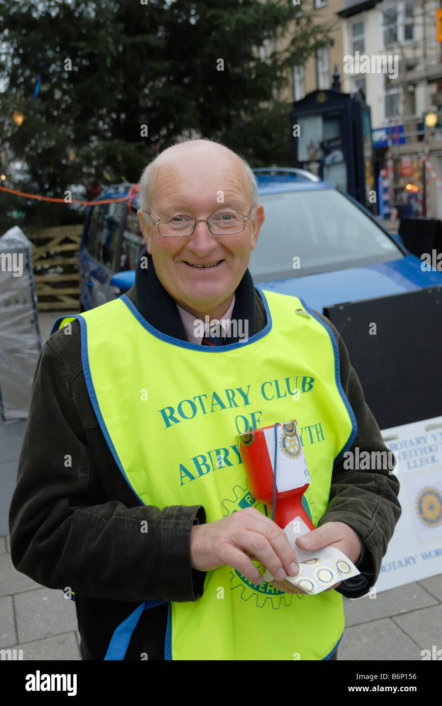 Elderly man collecting money for charity with the Aberystwyth Rotay ...