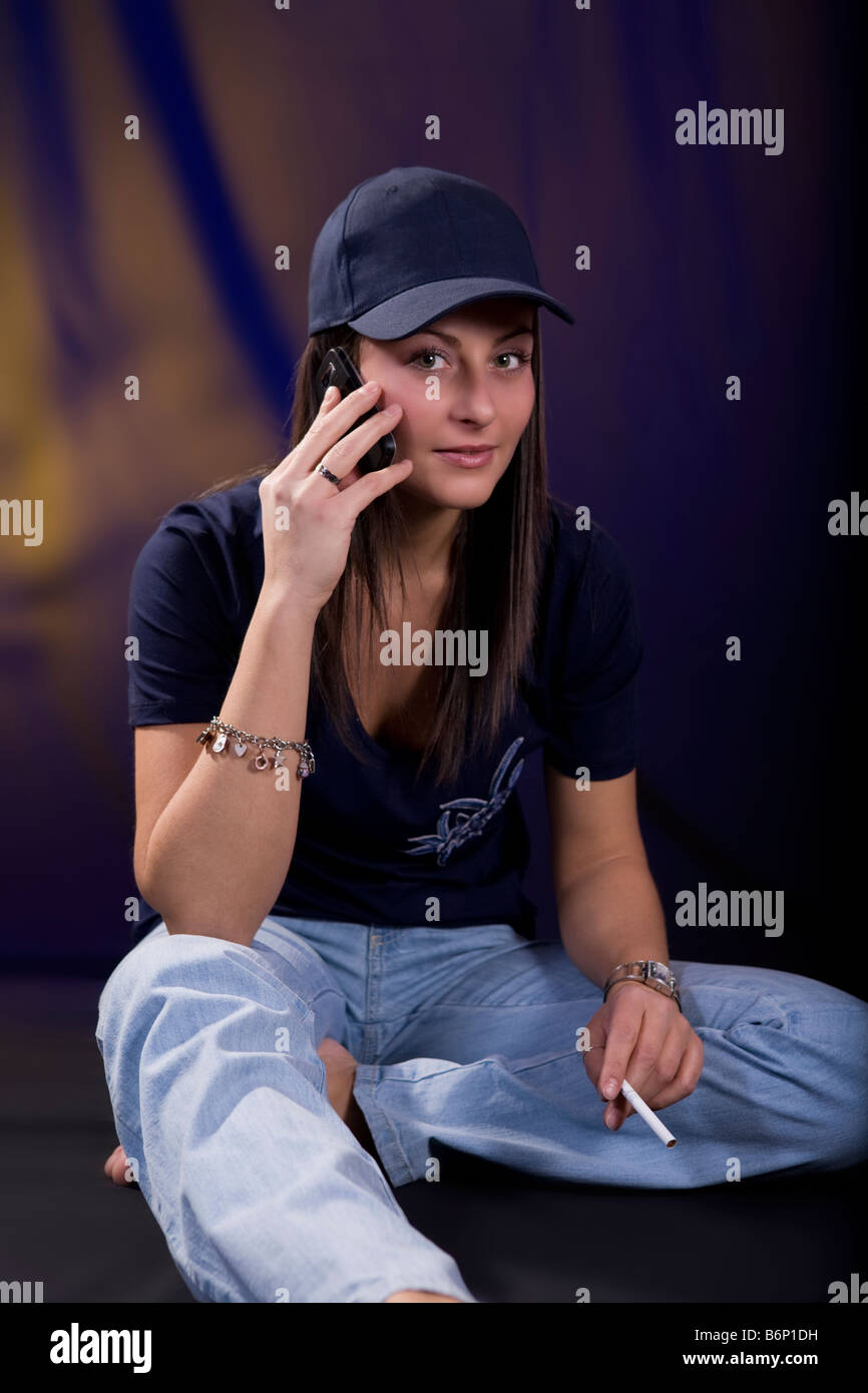 Smoking girl with a hat hi-res stock photography and images - Alamy