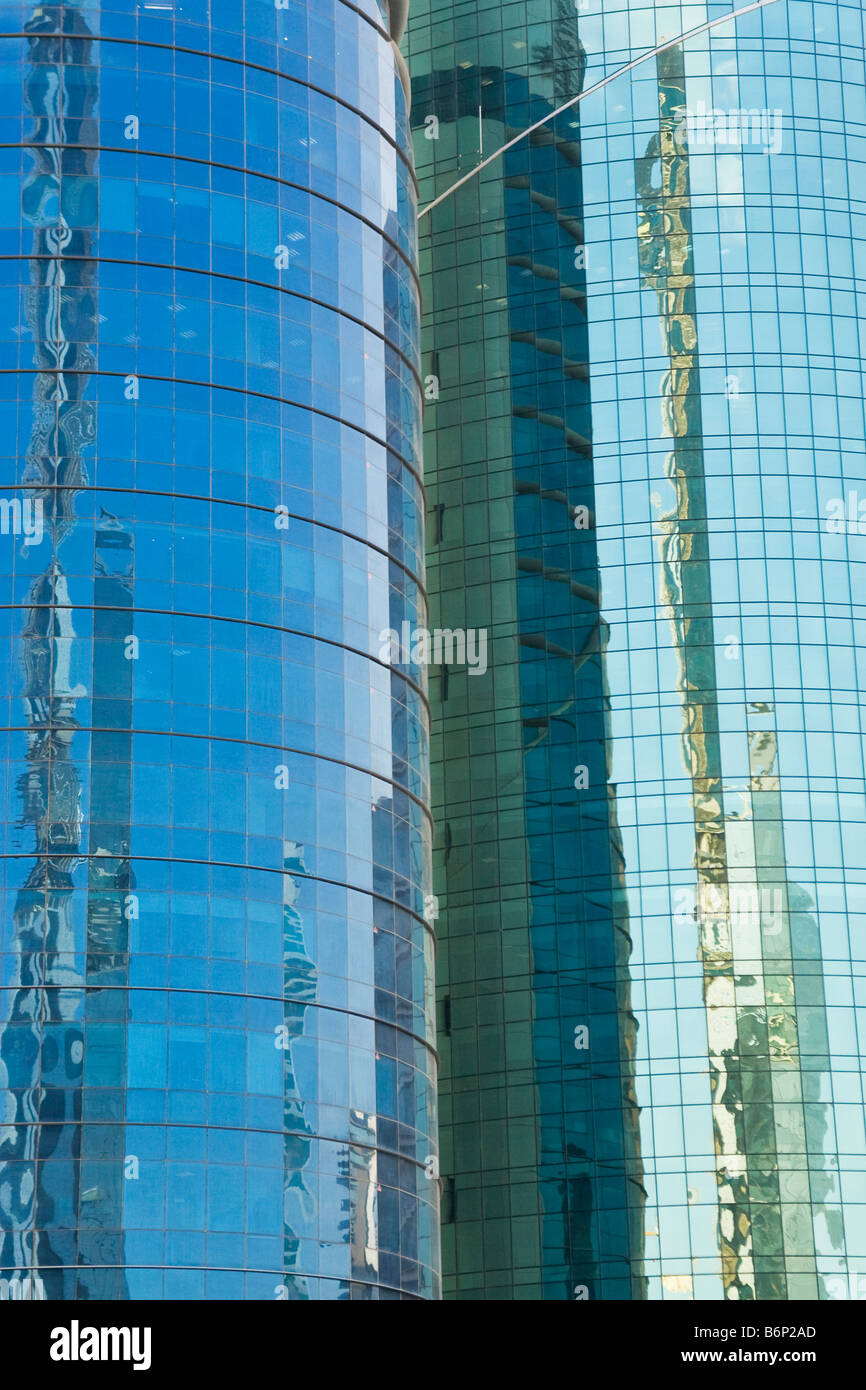 Full frame shot of tall glass clad modern buildings with reflections of ...