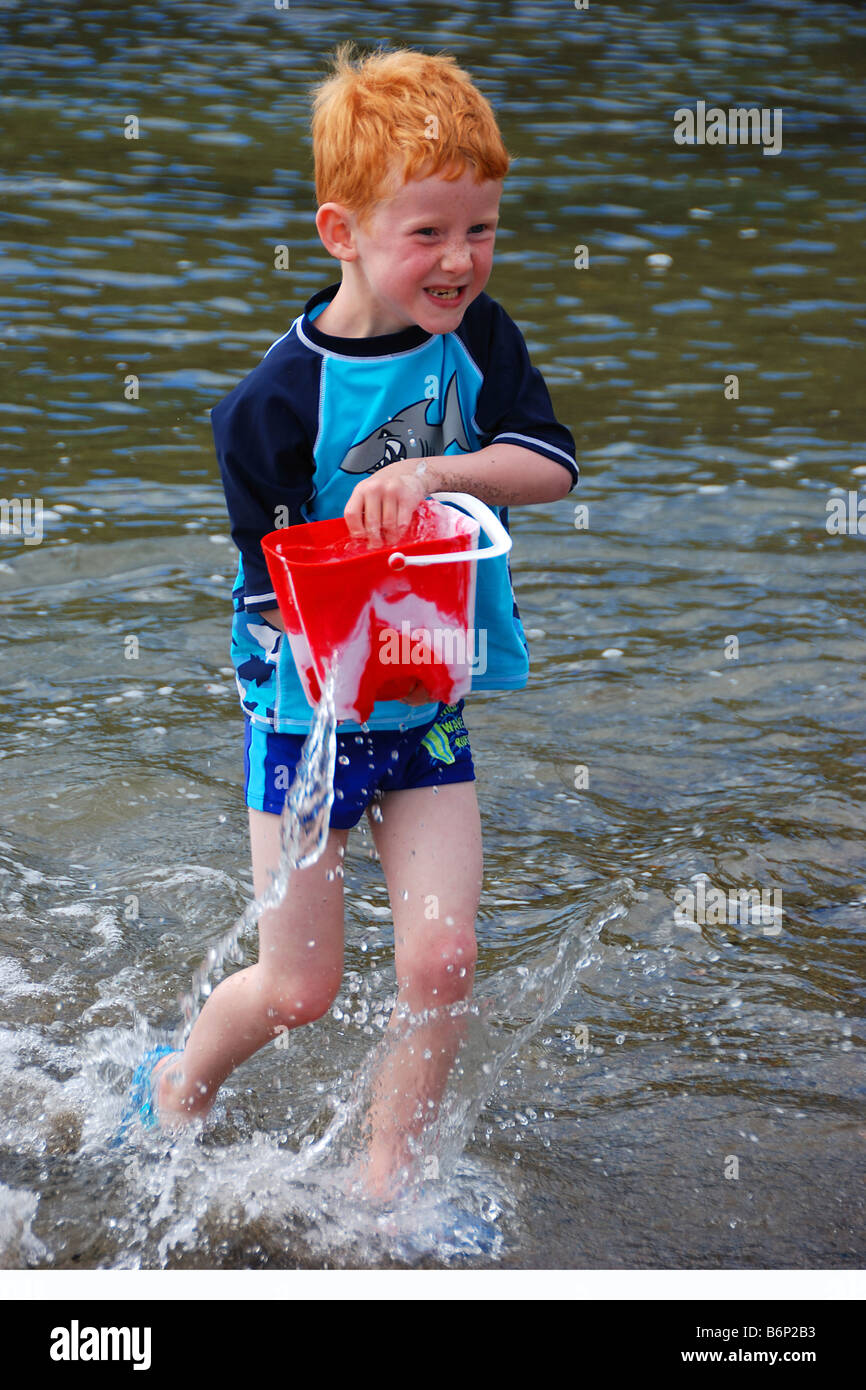 Bucket water pour fun hi-res stock photography and images - Alamy