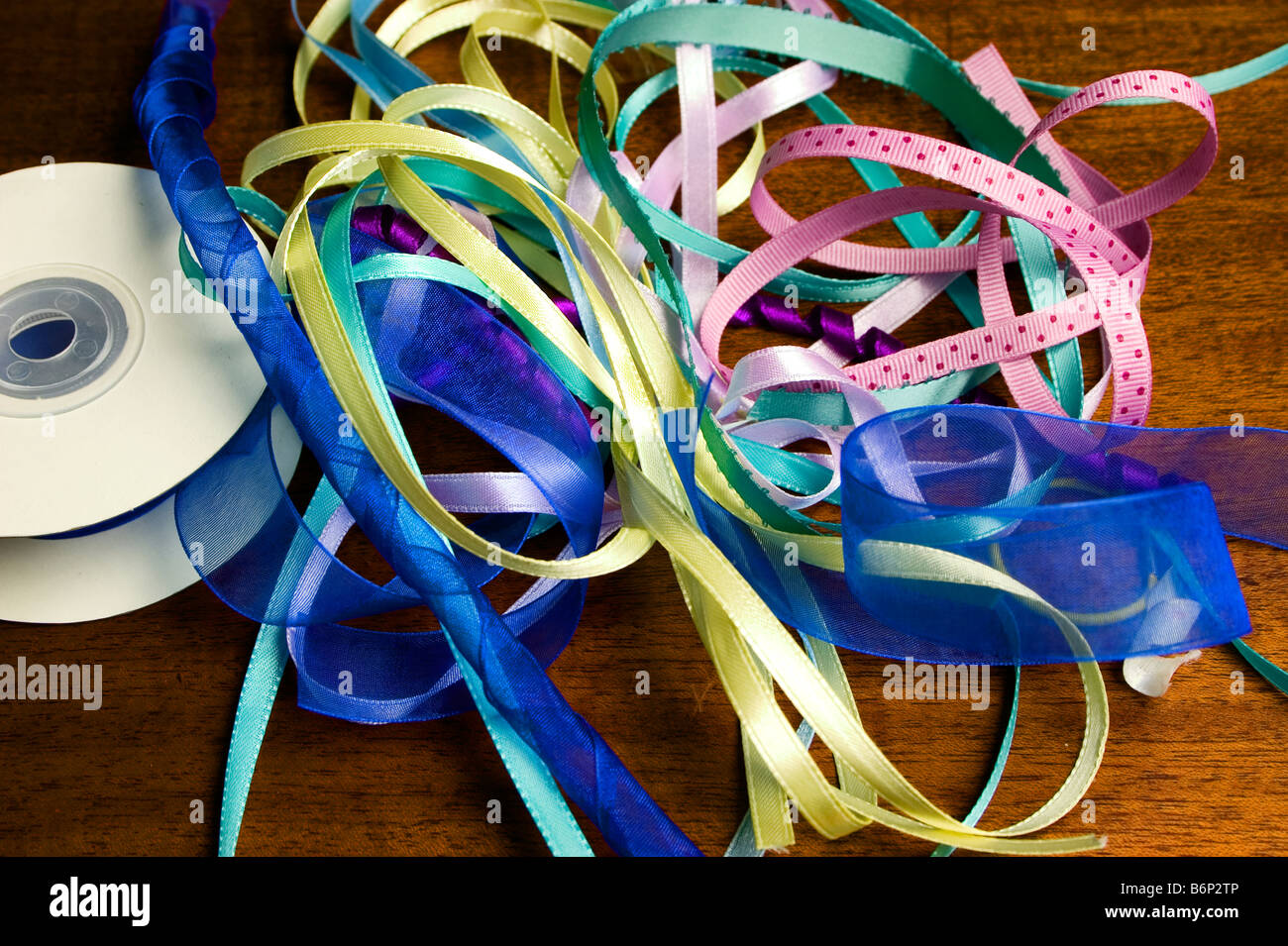 A pile of multi-colored ribbon sits on a table Stock Photo - Alamy