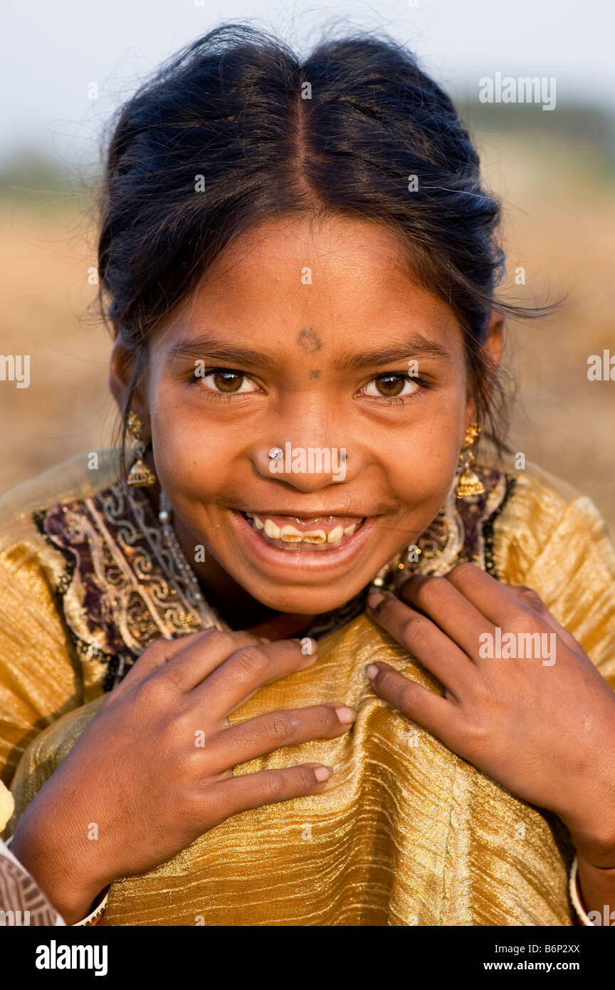 Very poor pretty indian gypsy girl in her golden dress smiling Stock ...