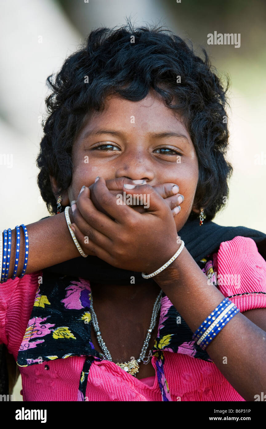 Very poor pretty indian gypsy girl laughing behind her hands. Andhra ...