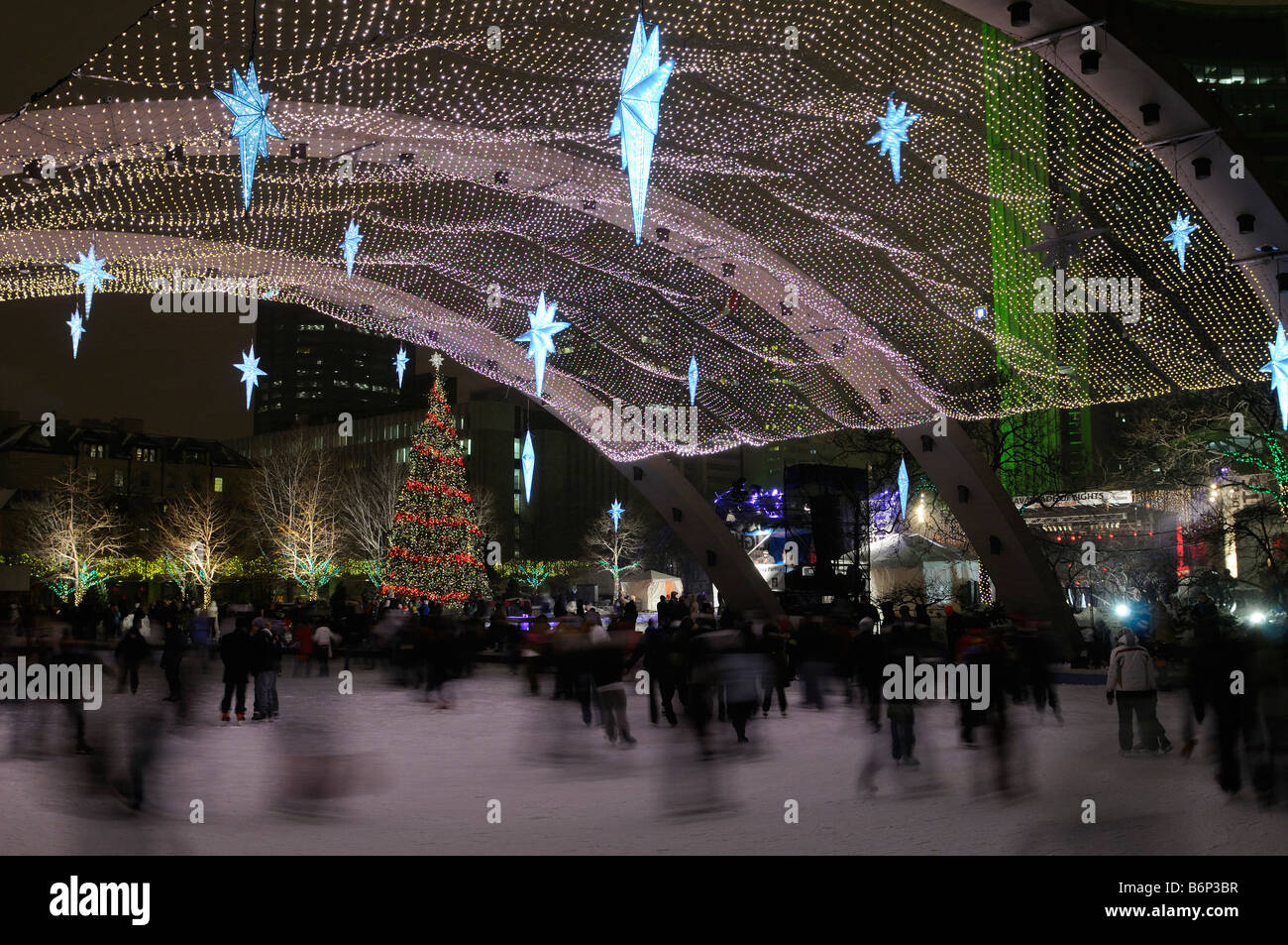 Skating party moving skaters on rink at night Nathan Phillips Square ...