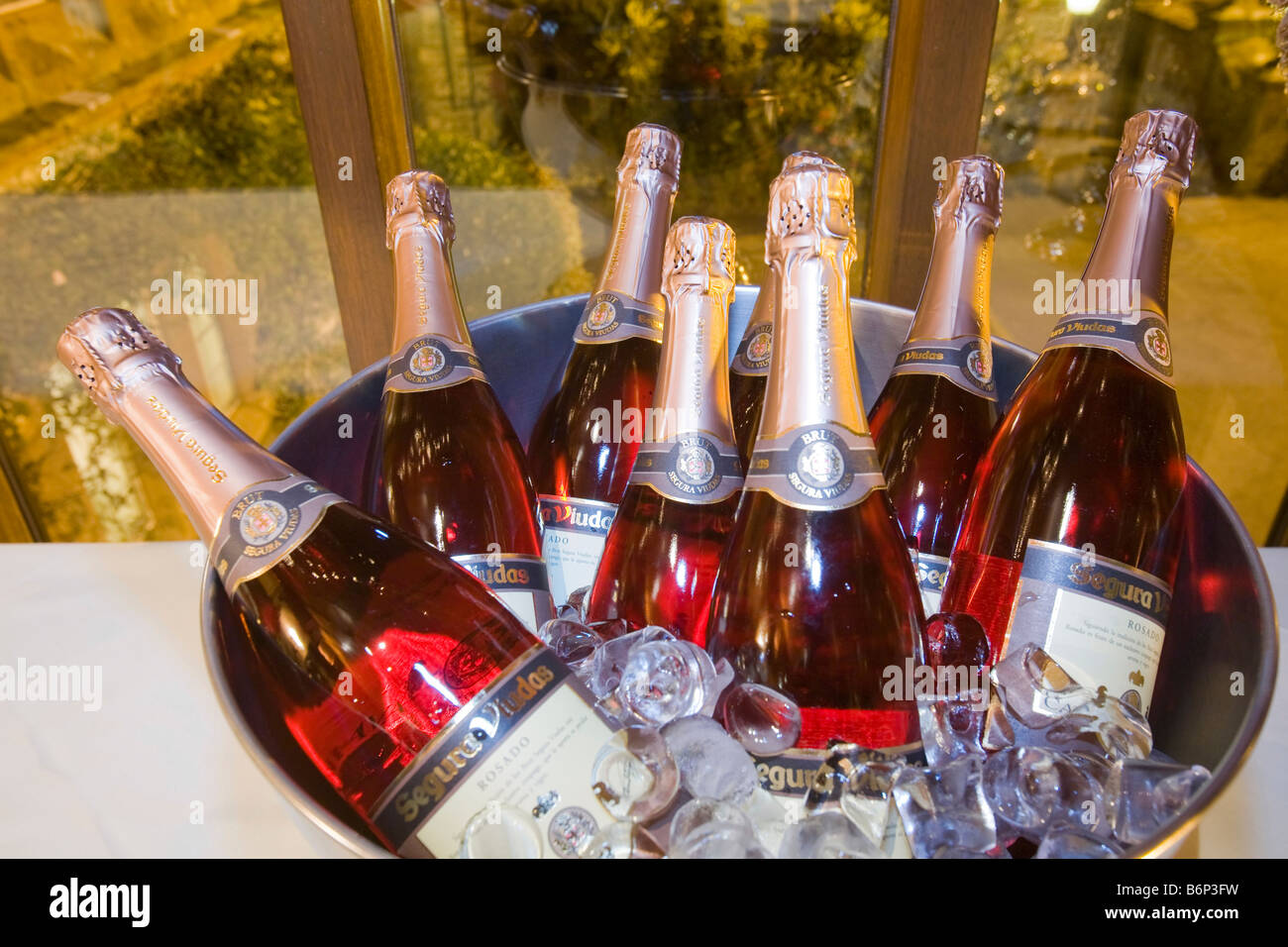 Bottles of sparkling wine on ice Stock Photo - Alamy