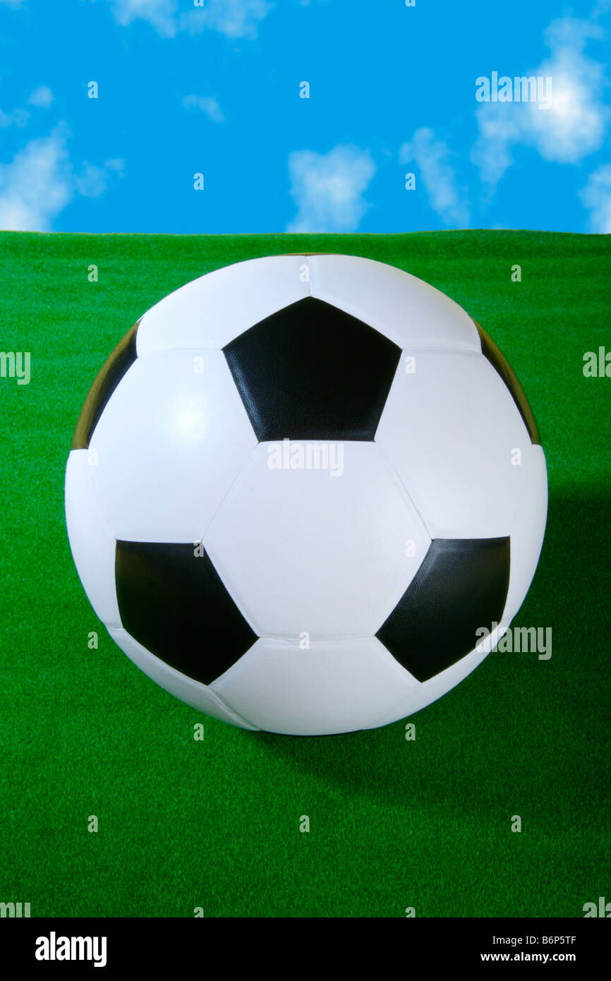 Studio shot of a black and white soccer ball shot from a medium angle ...